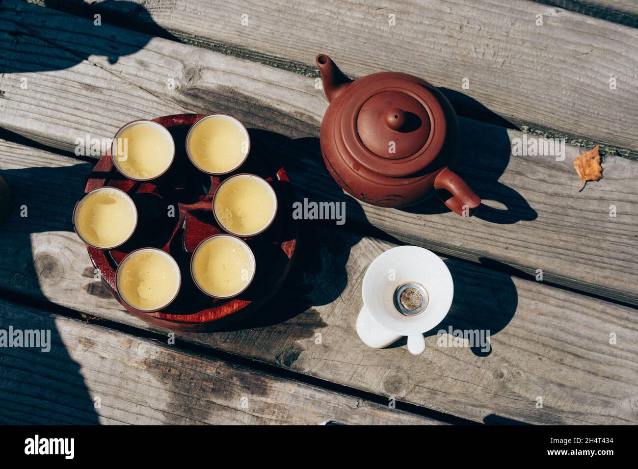 Tea ceremony, Woman pouring traditionally prepared tea Stock Photo - Alamy