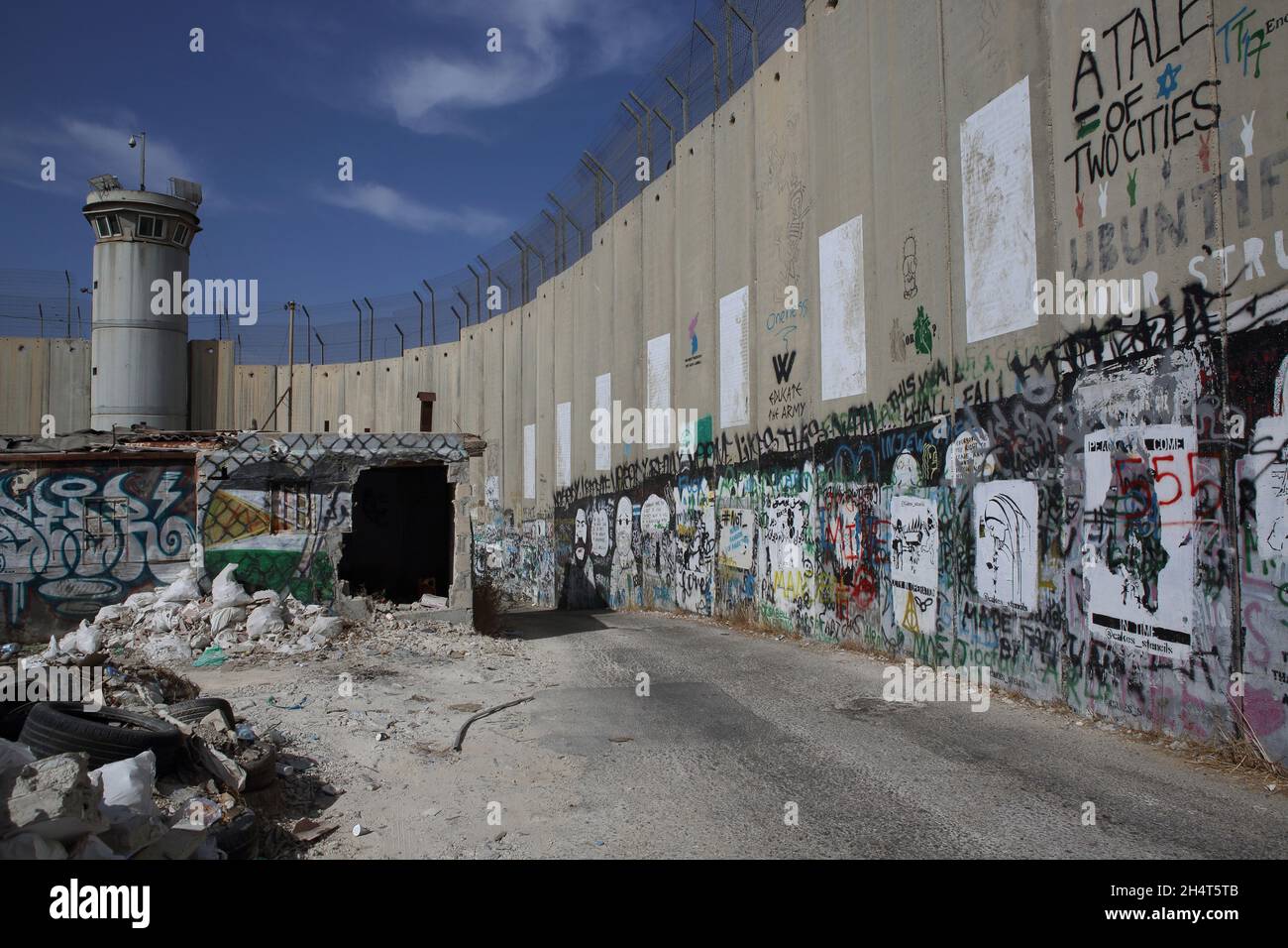 Political graffiti painted on the Palestinian side of the Wall of ...