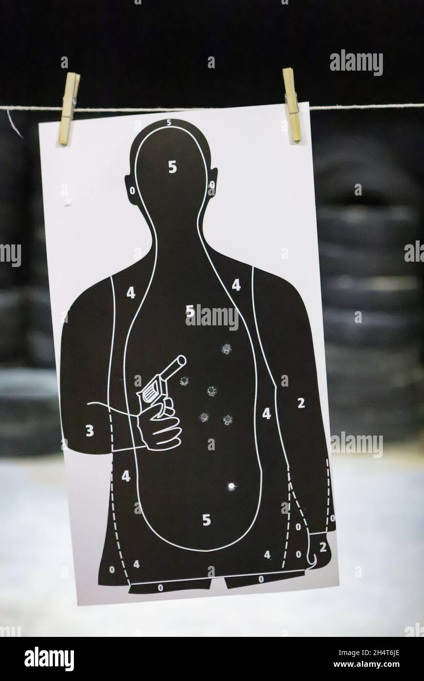 Target in white and black colors already used for shooting training ...