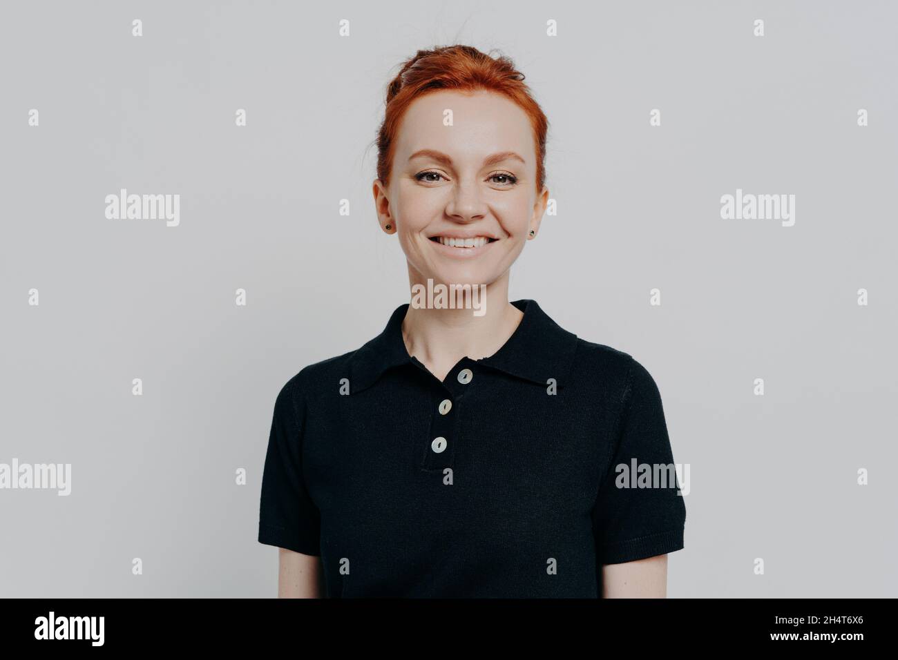 Young happy gorgeous redhead woman smiling at camera while posing ...