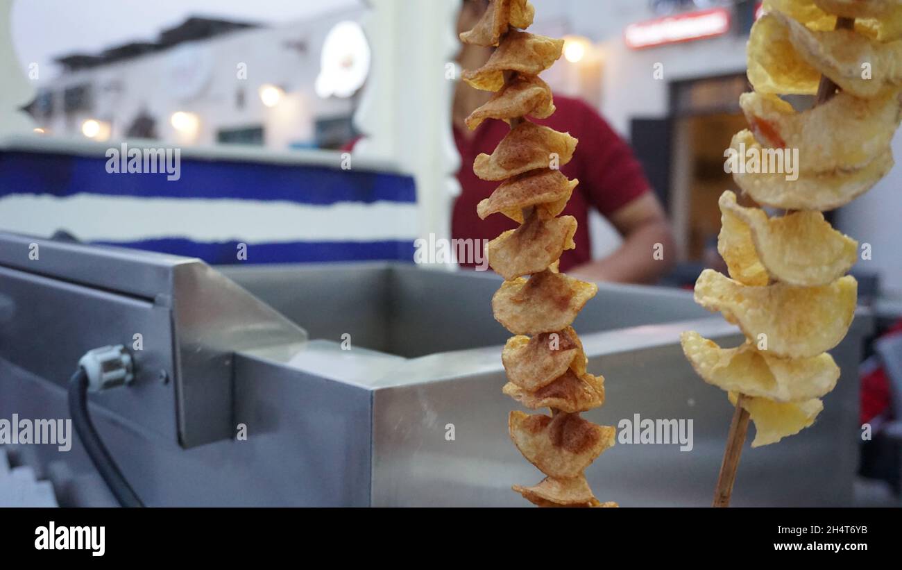 Spiral potato street food from the souq Stock Photo - Alamy