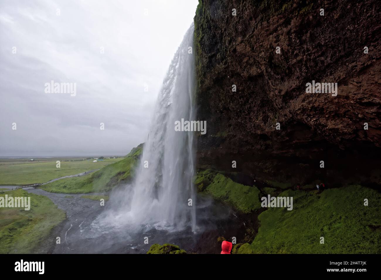 Seljalandsfoss waterfall plunging 60m from the cliff above, Sudhurland ...