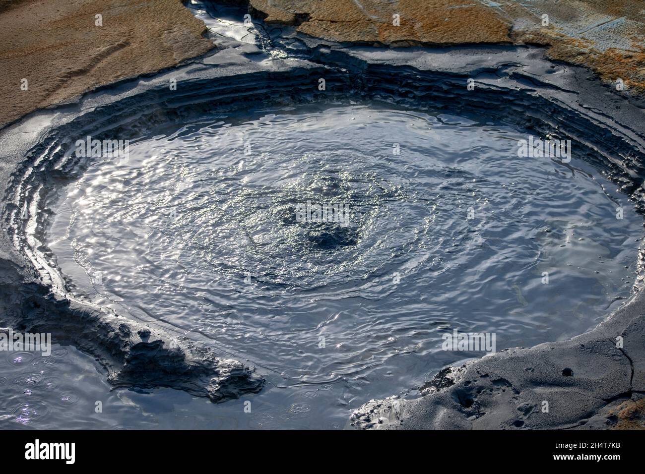 Landscape of Mt. Námafjall black steaming Fumaroles boiling mud pit ...