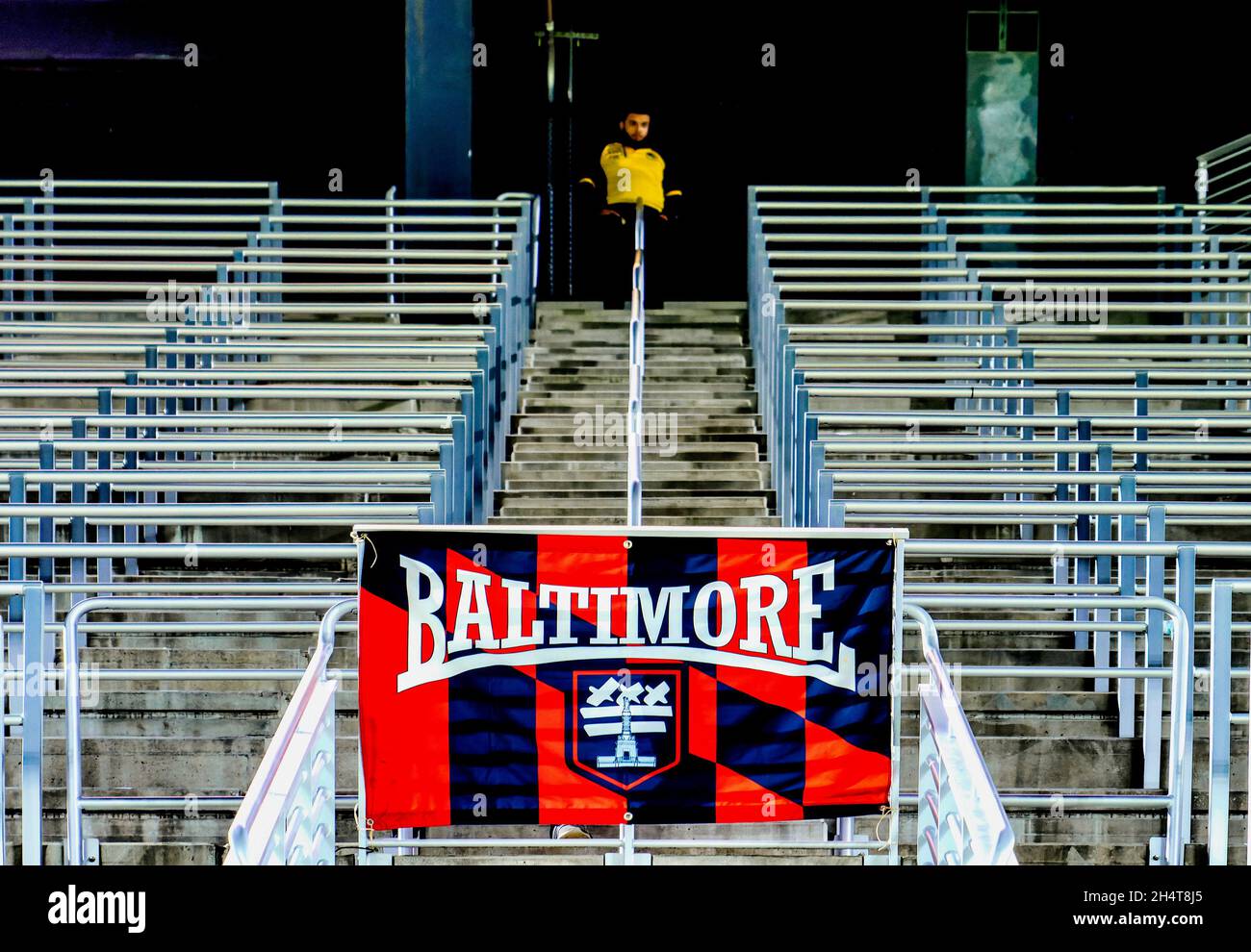 Man at the top of the stairs in an empty stadium Stock Photo - Alamy