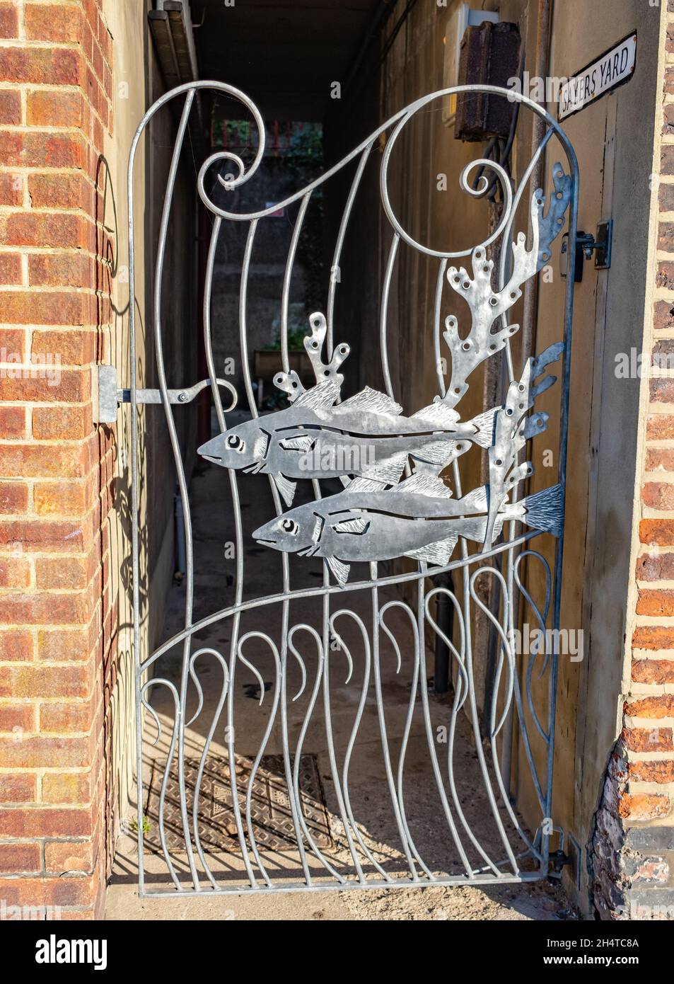 Decorative metal gate embossed with fish securing the entrance to ...