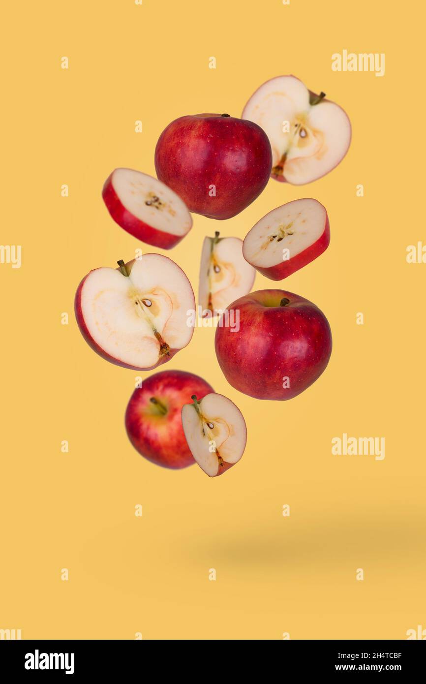 Minimal fruit idea with fresh sliced and whole apple floating in the ...