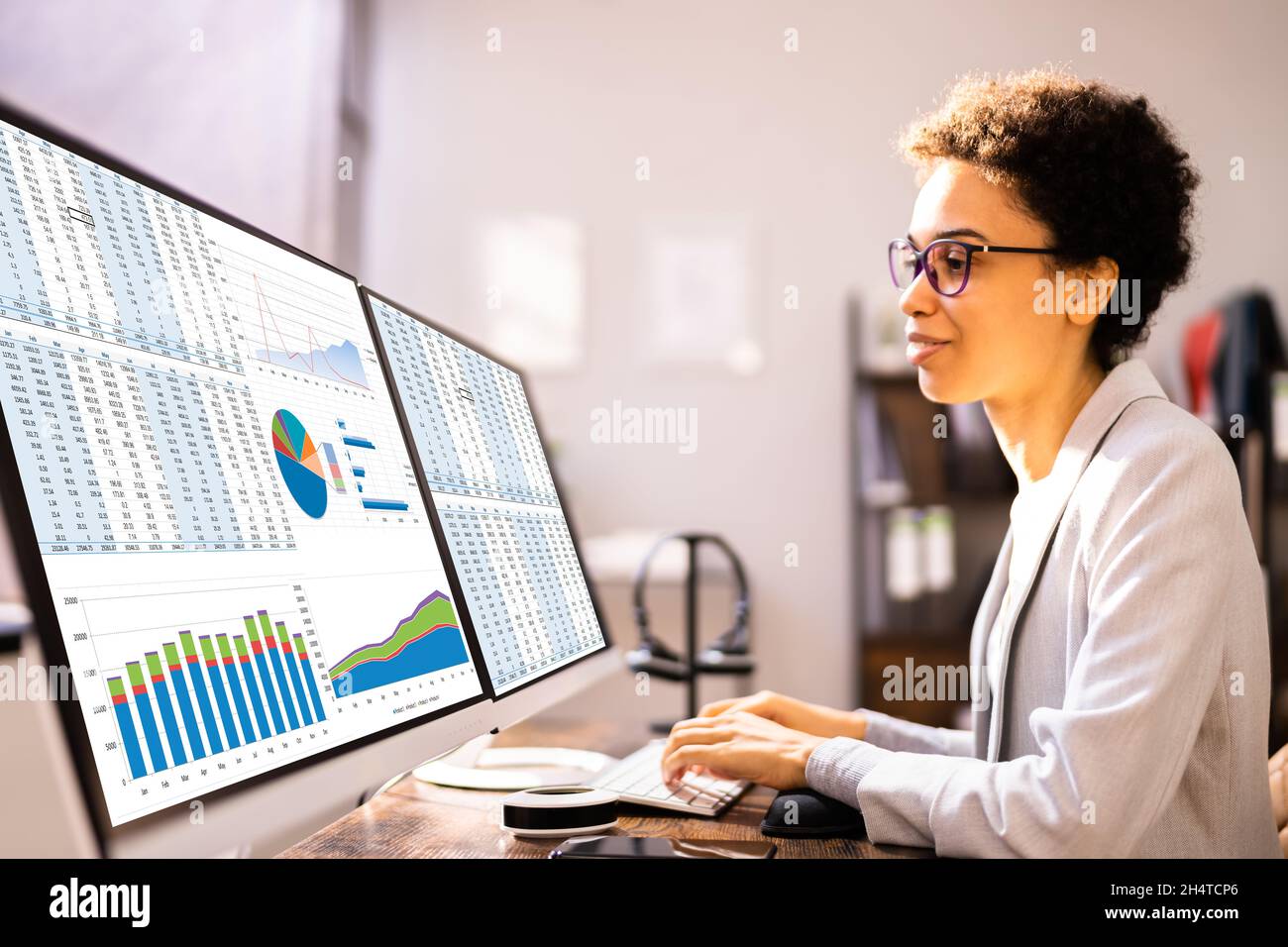 Computer Spreadsheet Data Analyst Woman Using Multiple Screens Stock ...