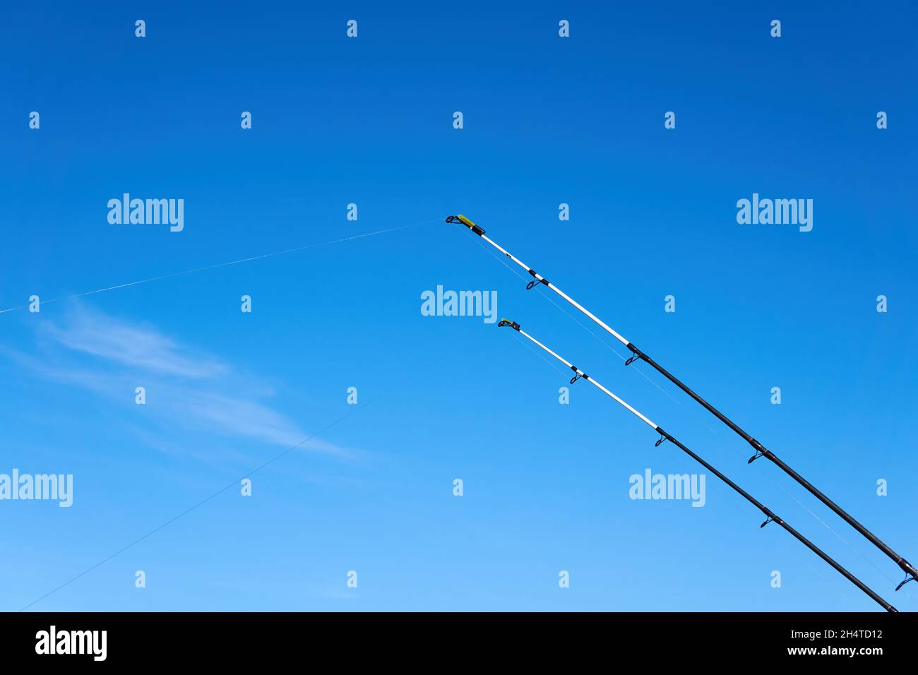 Fisherman two spinning rods hi-res stock photography and images - Alamy
