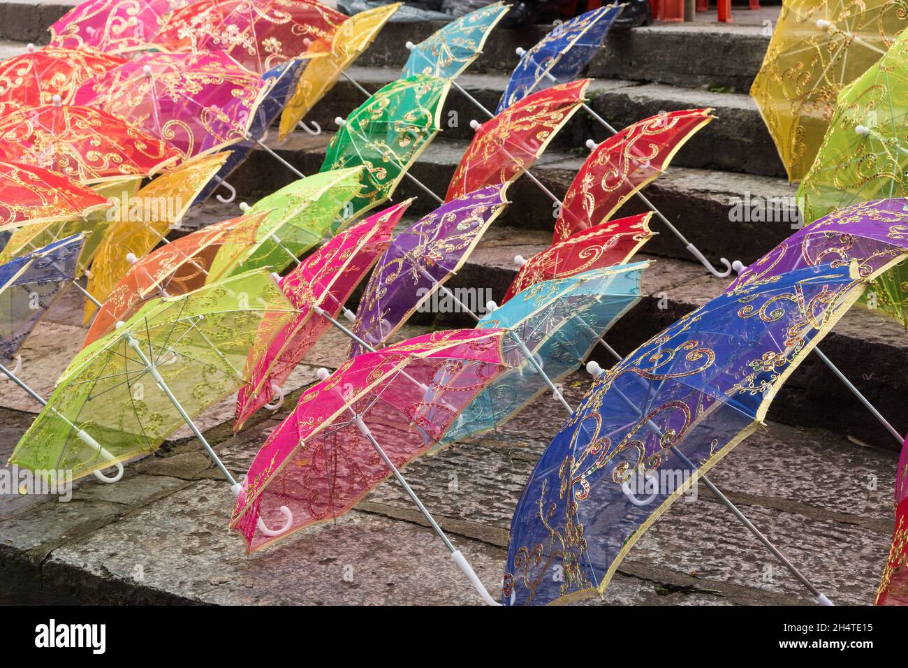 Colorful, decorated parasols on stone steps in Yangshuo, China Stock ...