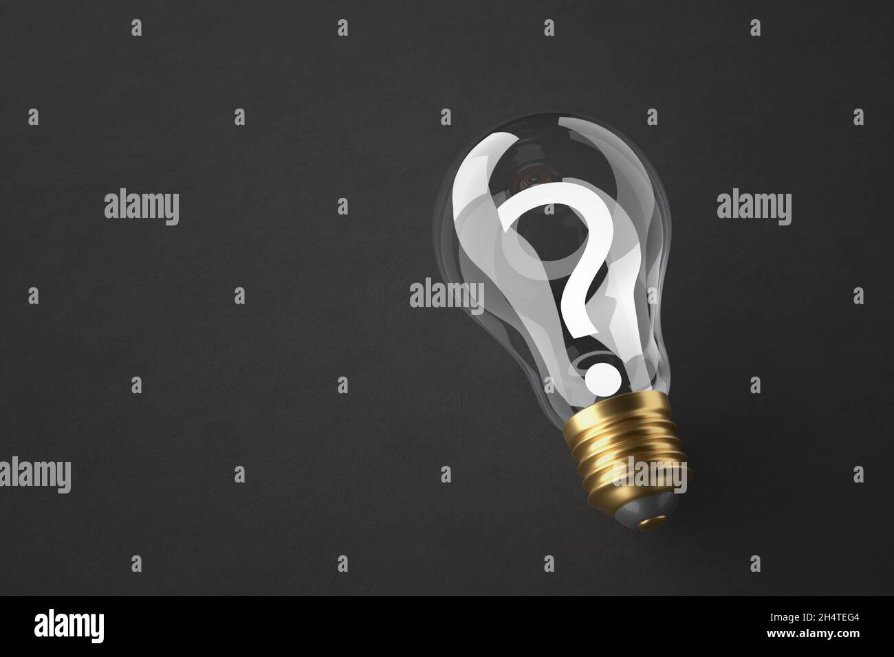 Question mark inside the light bulb on the gray table. The concept of ...