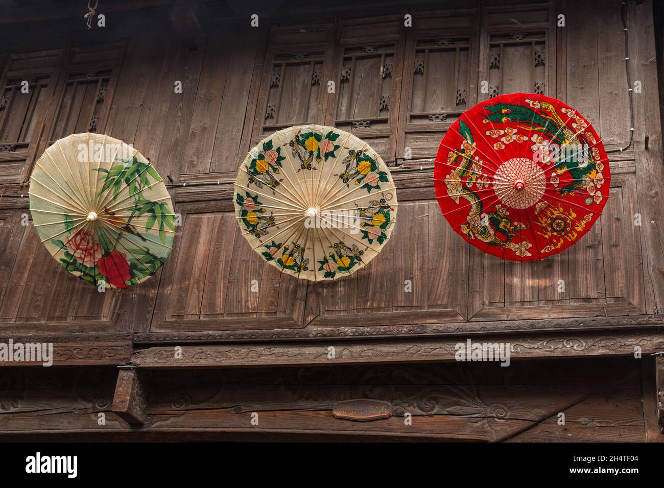 Colorful hand-painted parasols on display on a shop in the town of ...