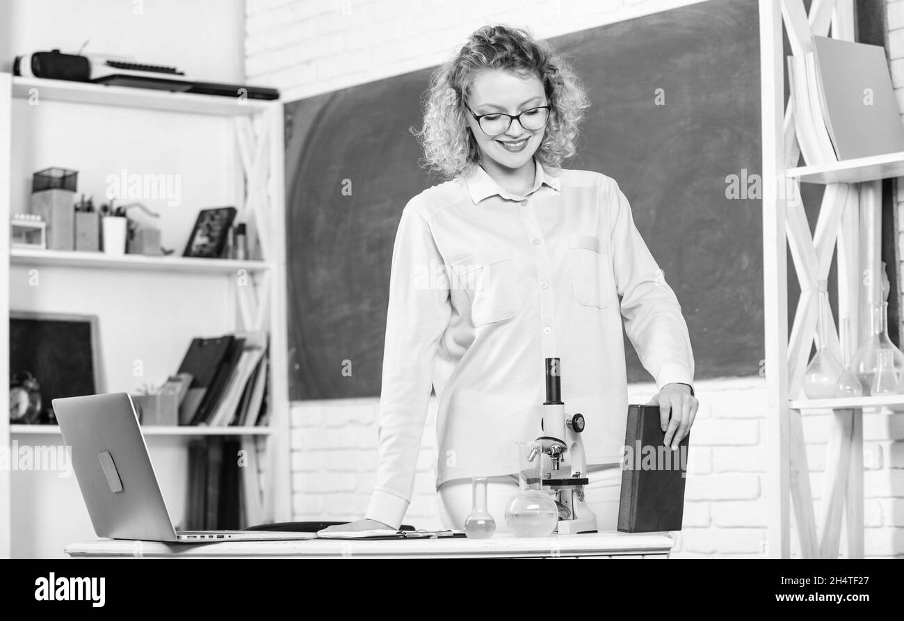 Girl adorable teacher in classroom. Educational program for primary ...
