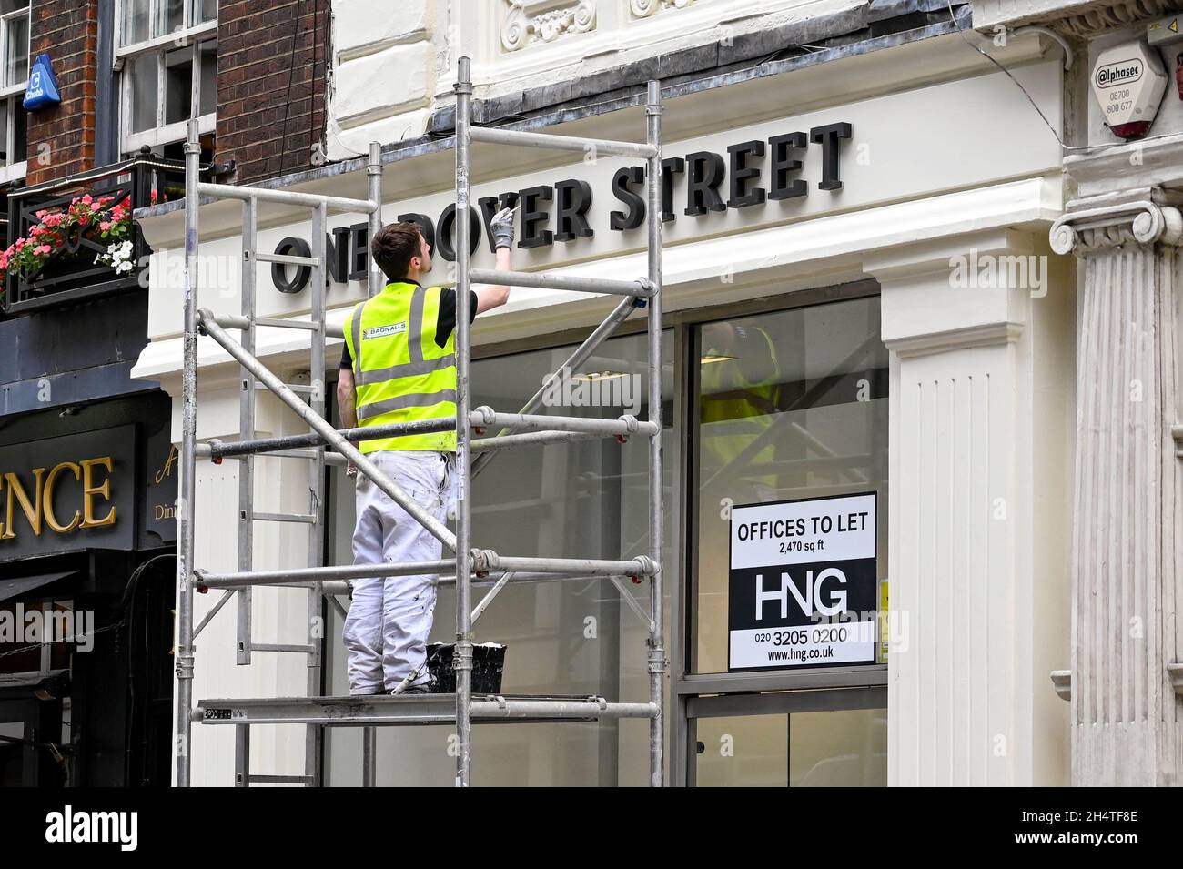 London, England - August 2021: Person standing on a construction ...