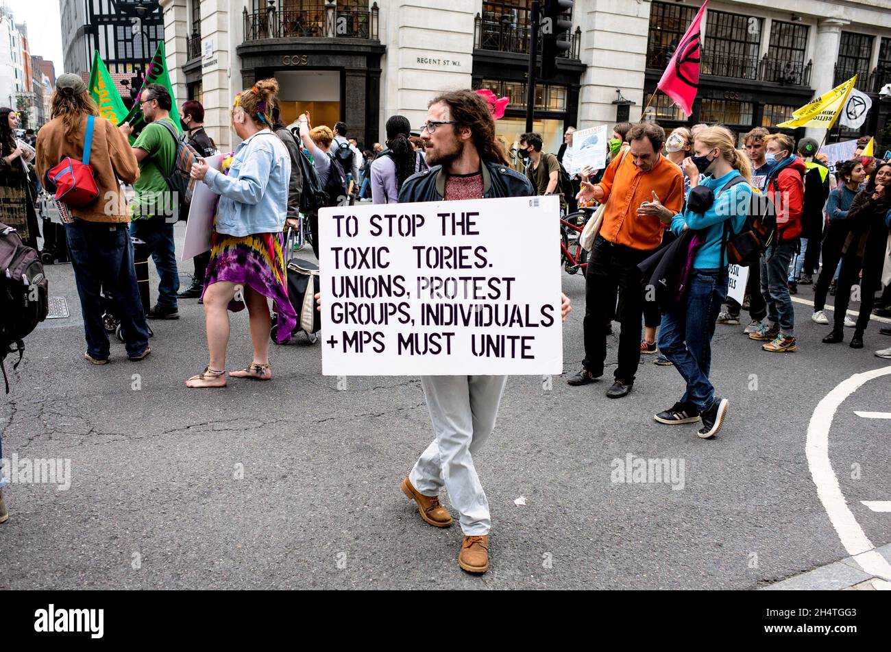 Climate Change Activist with banner Stock Photo - Alamy