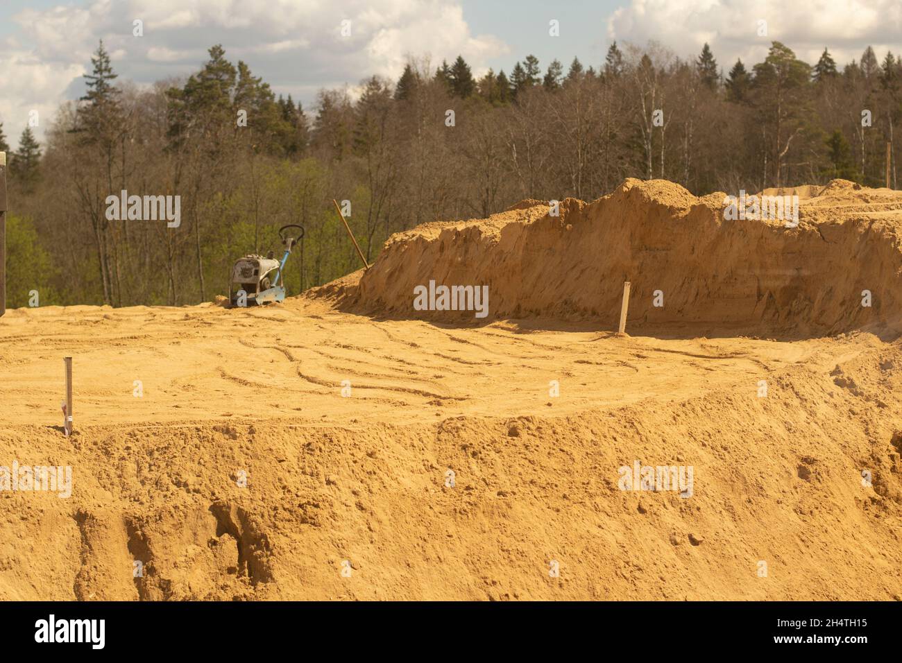 Sand platform. Laying sand in the base. A lot of building material ...