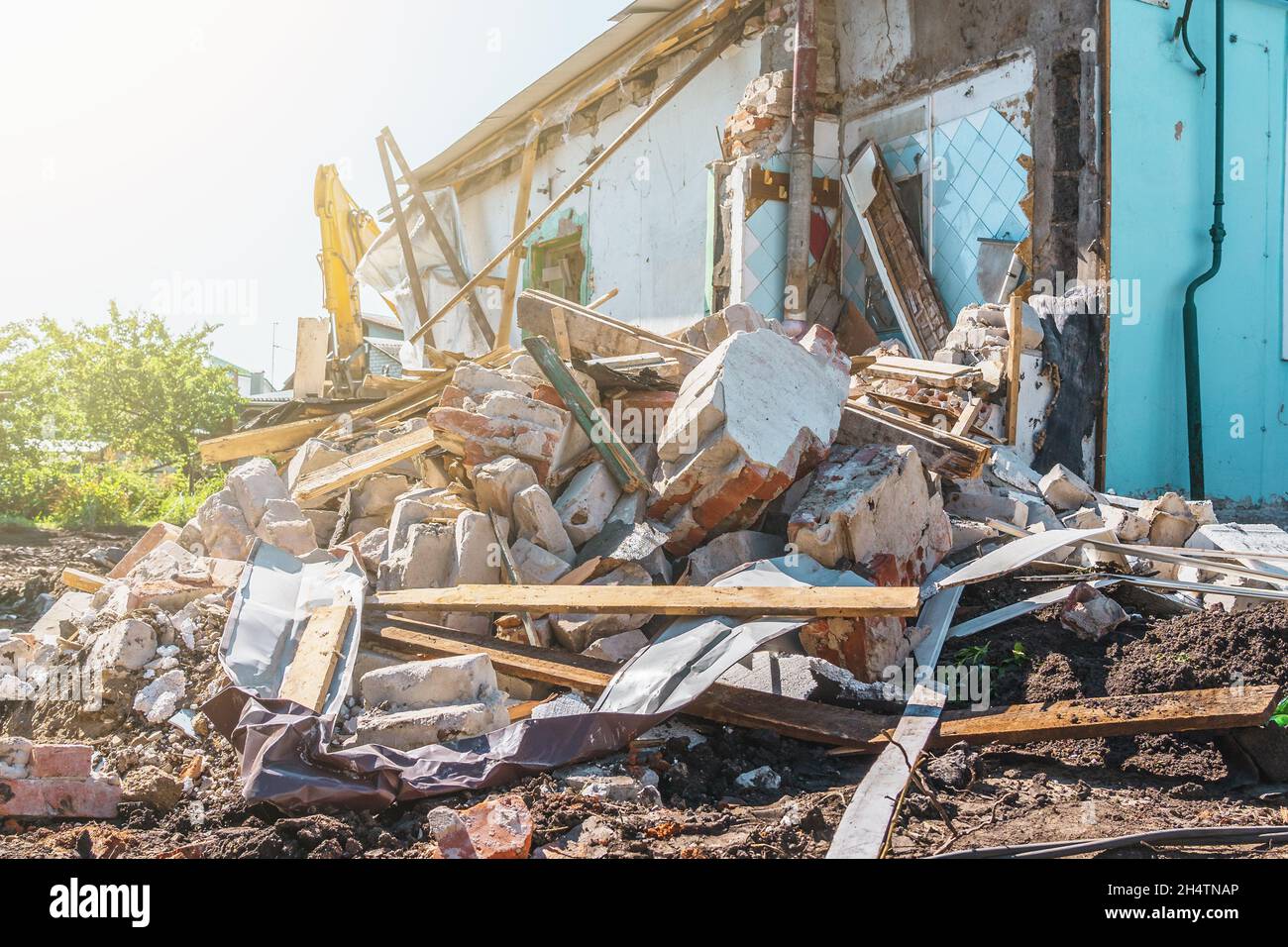 Demolition of building. Ruins of demolished house with broken wall ...