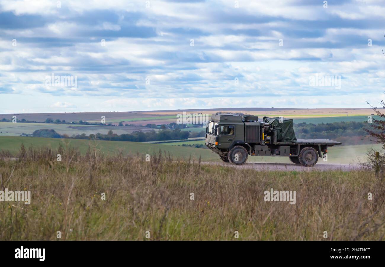 British army MAN SV HX 60 4x4 18.330 platform truck, part laden on a ...
