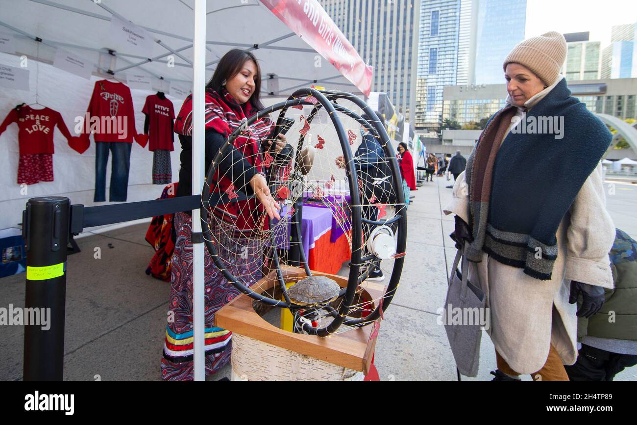 Toronto, Canada. 4th Nov, 2021. A visitor looks at an indigenous ...