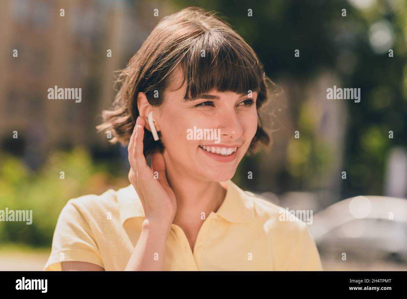 Portrait of attractive cheerful girl talking on cell roaming using ...