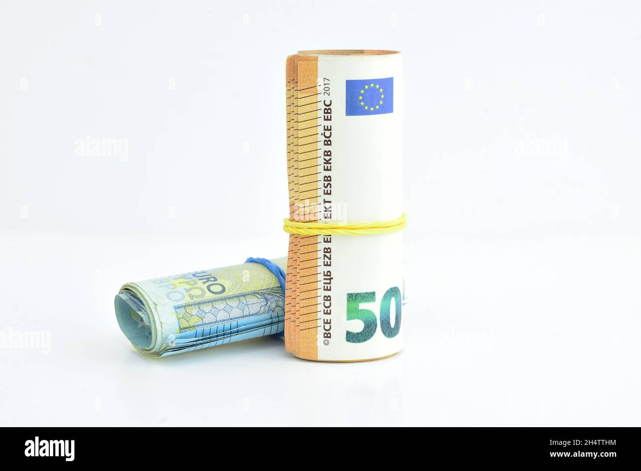 Rolls of wrapped Euro banknotes isolated on a white background Stock ...
