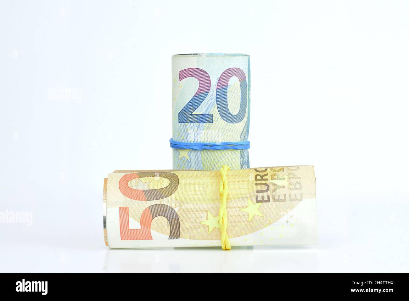Rolls of wrapped Euro banknotes isolated on a white background Stock ...
