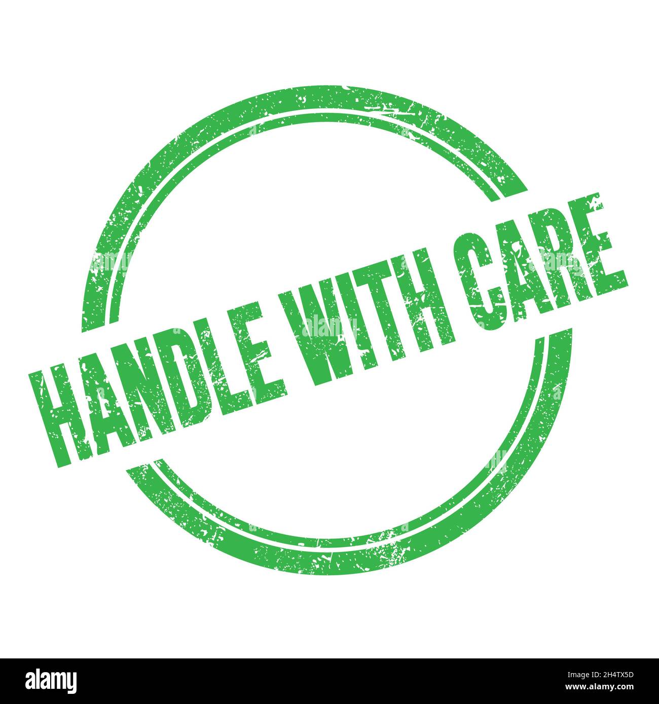 HANDLE WITH CARE text written on green grungy vintage round stamp Stock ...