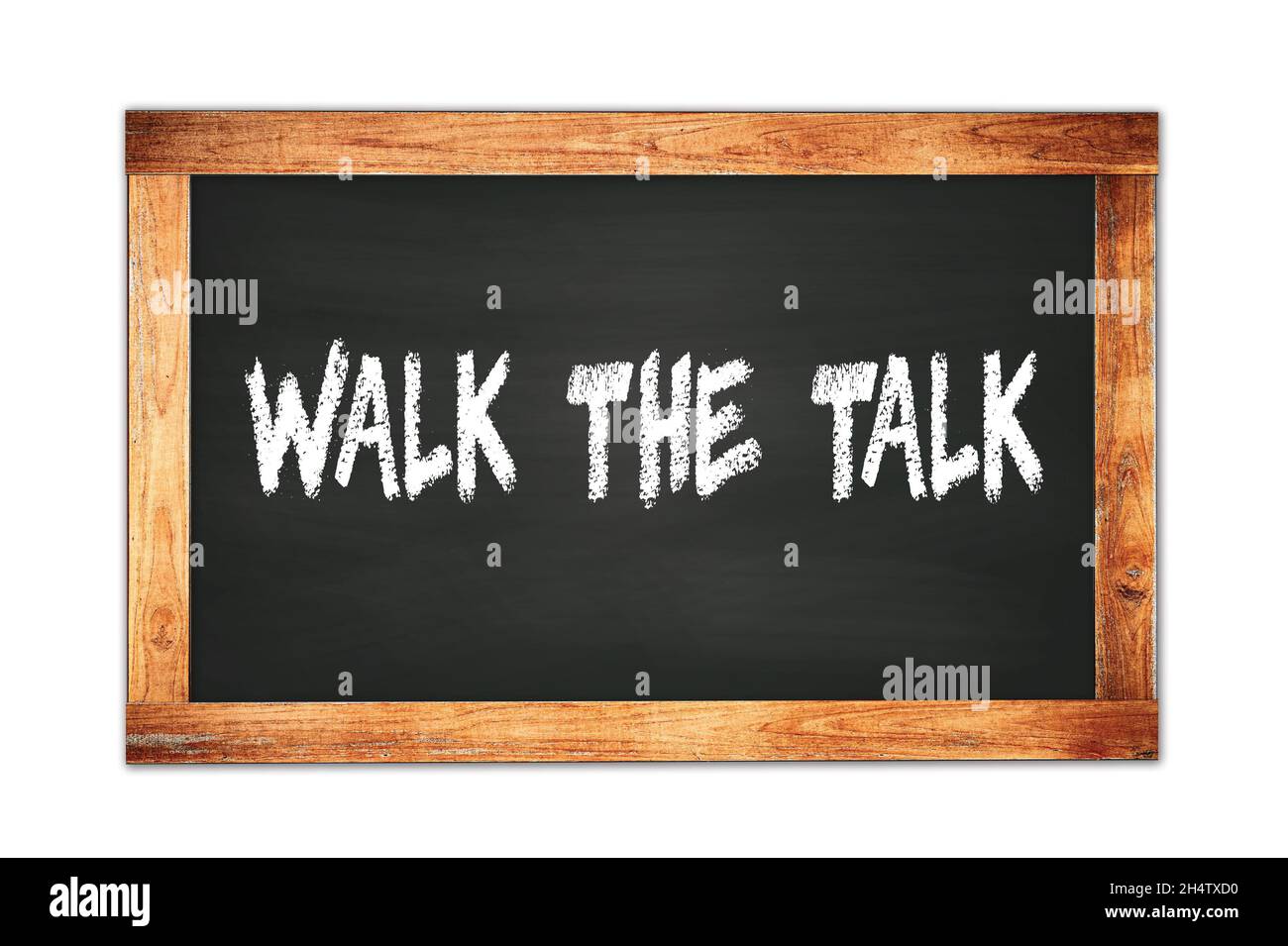 WALK THE TALK text written on black wooden frame school blackboard ...