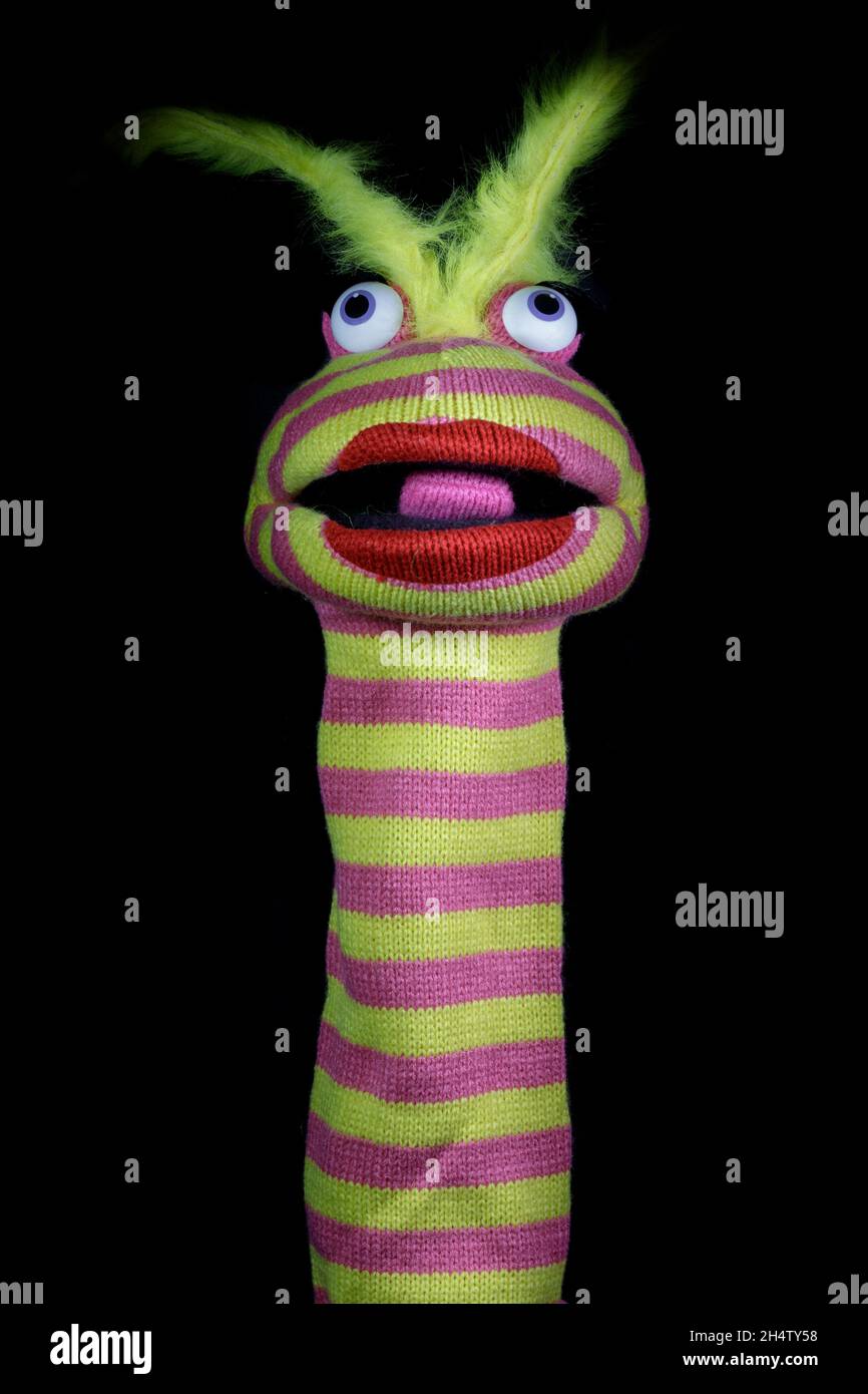 Sock Puppet Isolated Against Black Background Stock Photo - Alamy