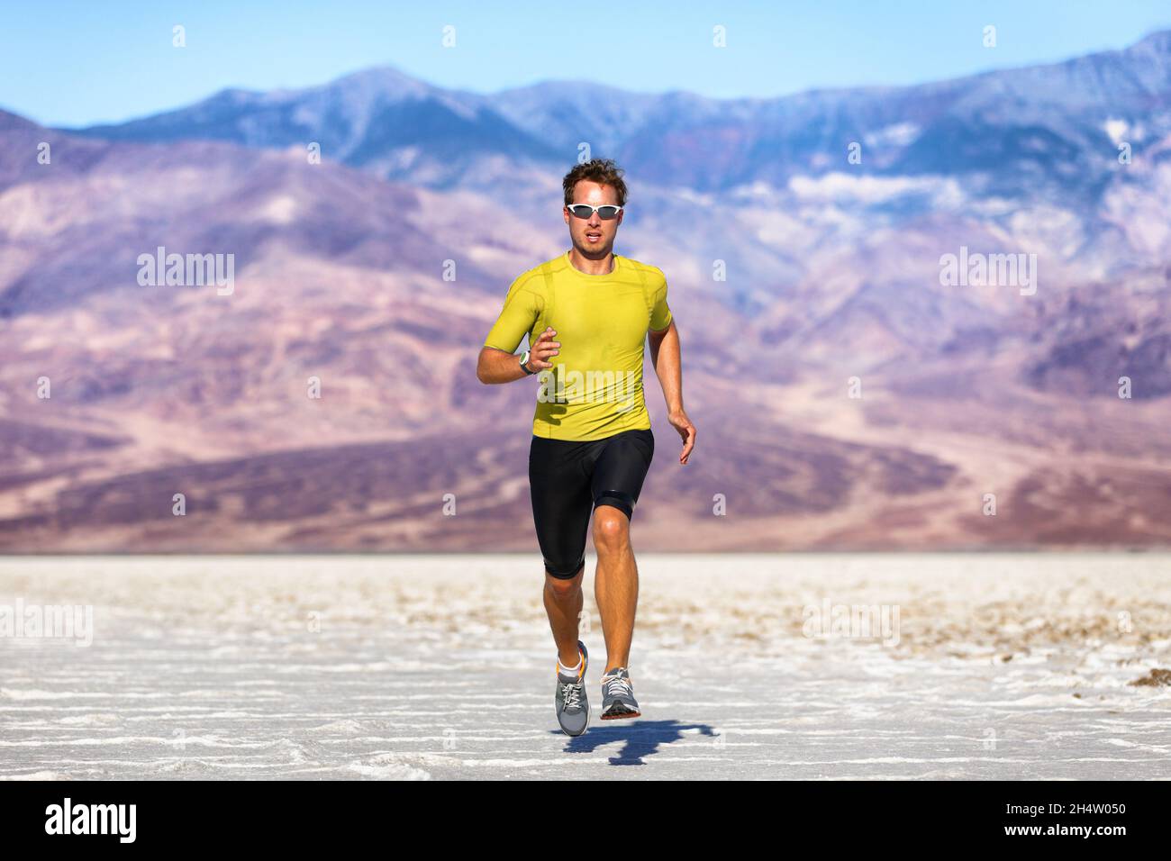 Running man - sprinting athlete runner in summer desert nature ...