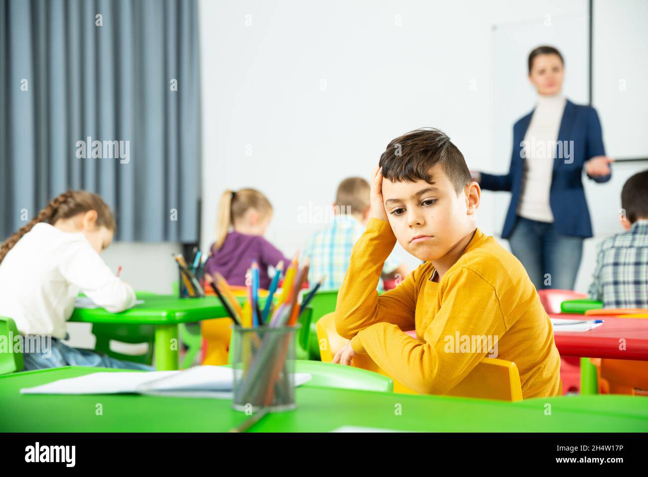 Child sitting separately in class hi-res stock photography and images ...