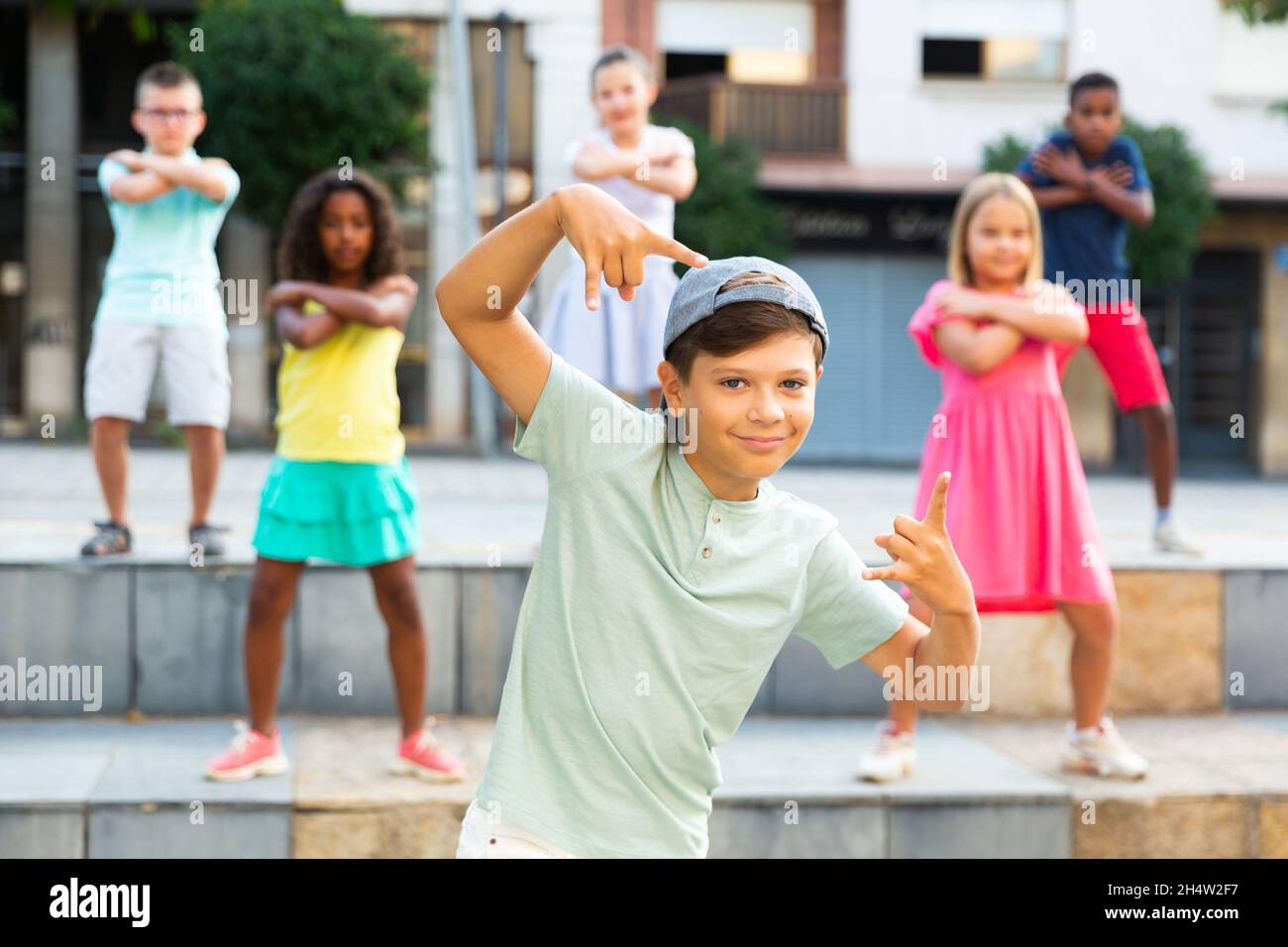 Group of kids performing street dance outdoors Stock Photo - Alamy
