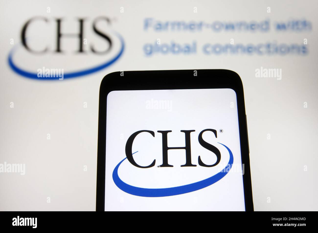 In this photo illustration, a CHS Inc. logo is seen on a smartphone and ...