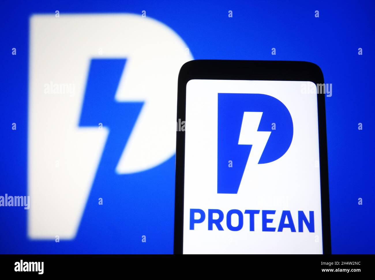 In this photo illustration a Protean Electric logo is seen on a ...