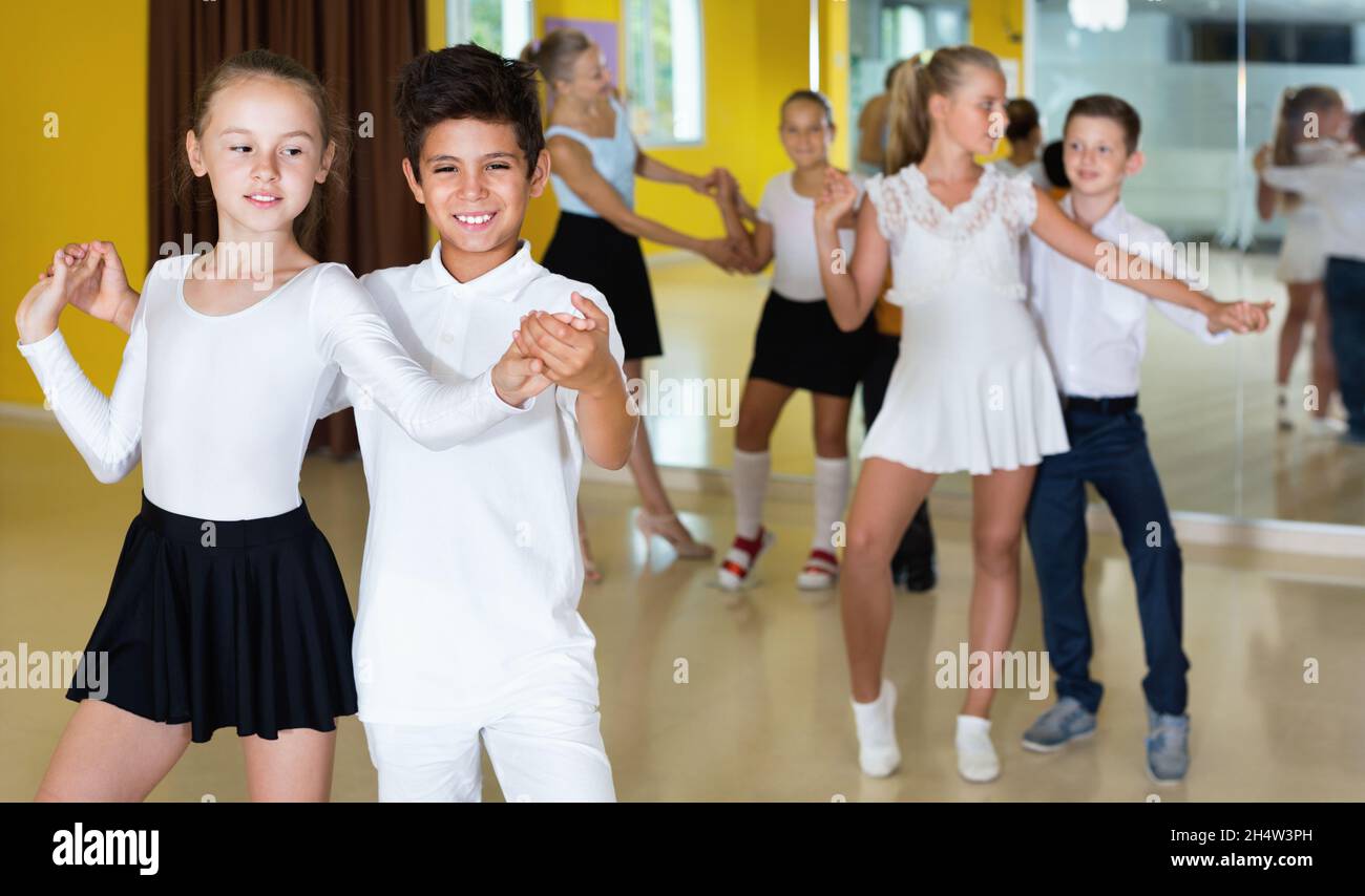 Group of children dancing tango in dance studio Stock Photo - Alamy