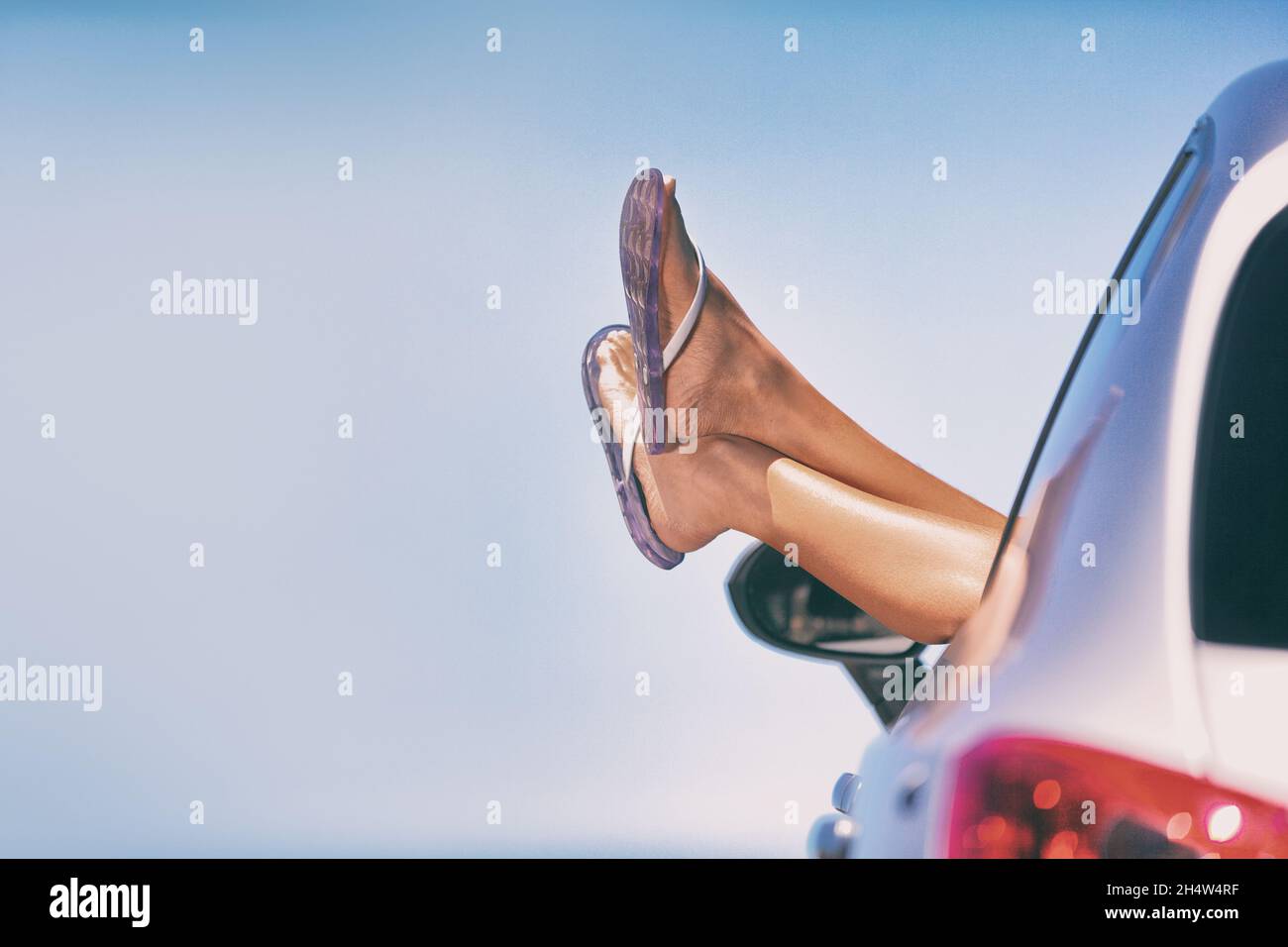 Summer road trip vacation car woman feeling carefree relaxing sleeping ...