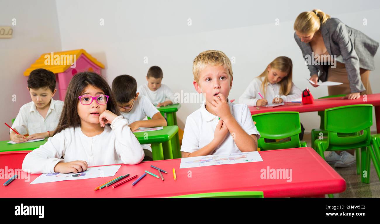 Surprised pupils in classroom Stock Photo - Alamy