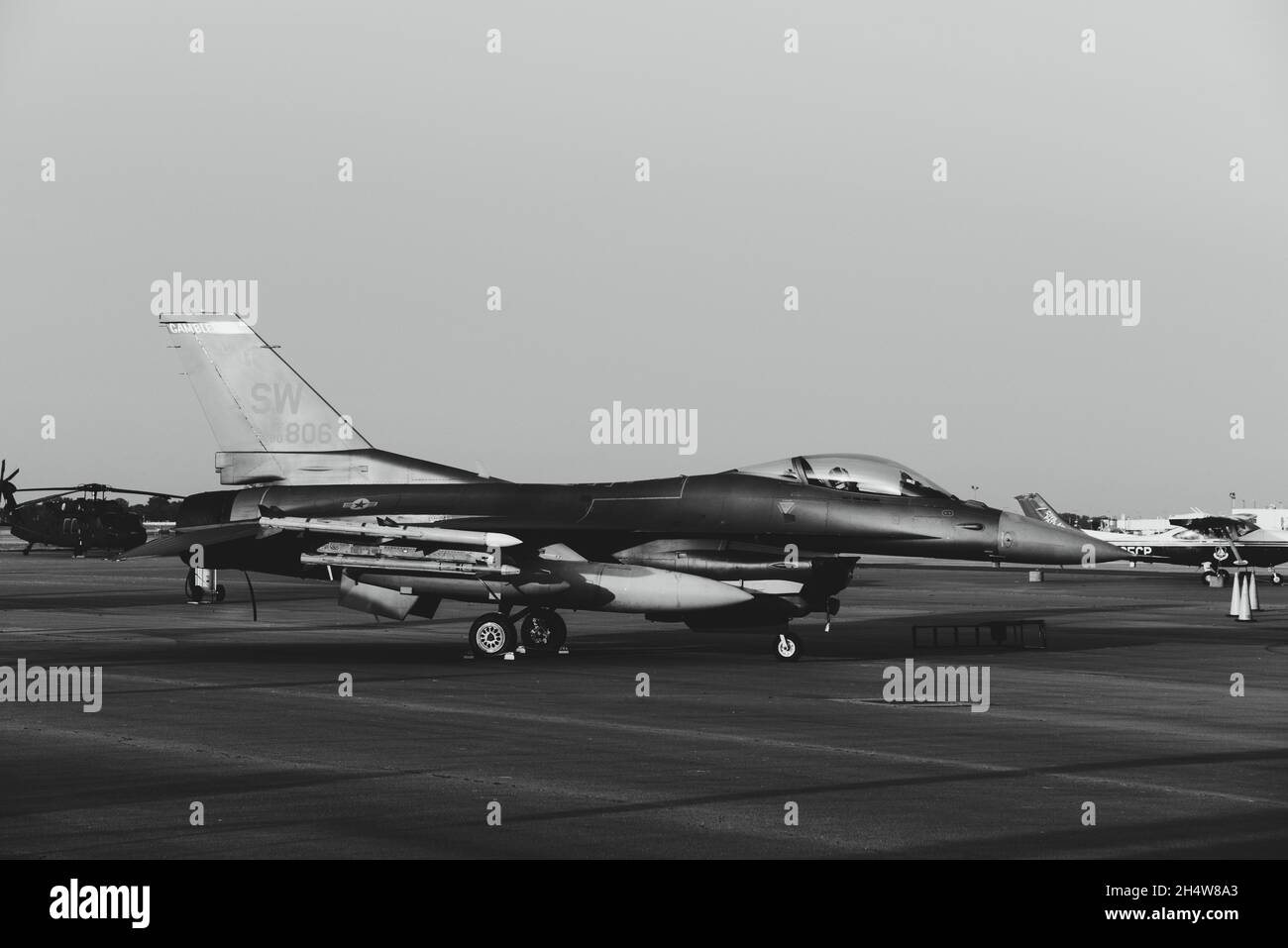 Grayscale of a military aircraft about to take off in an airbase Stock ...