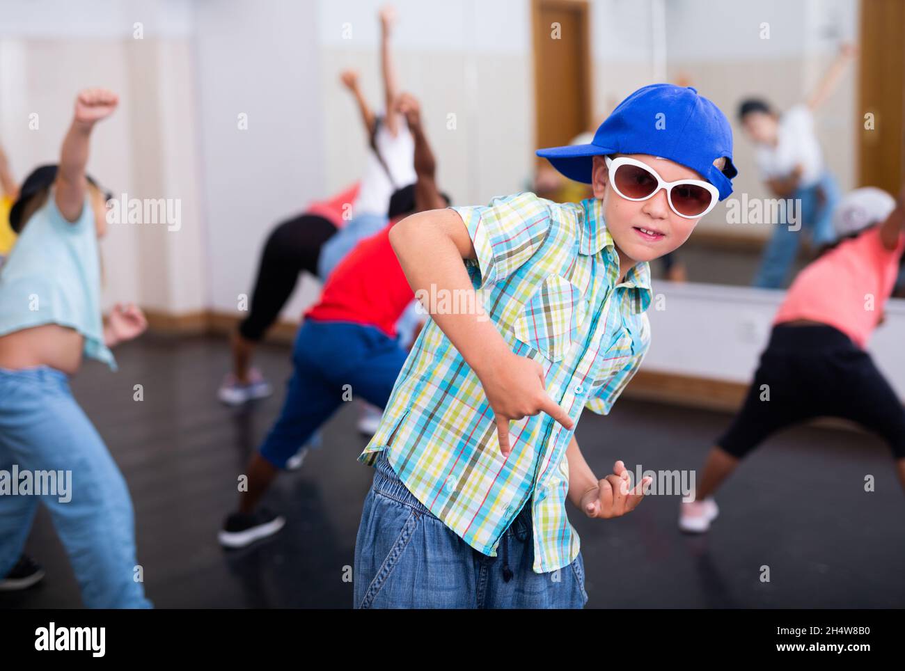 Tween boy hip hop dancer posing during group class Stock Photo - Alamy