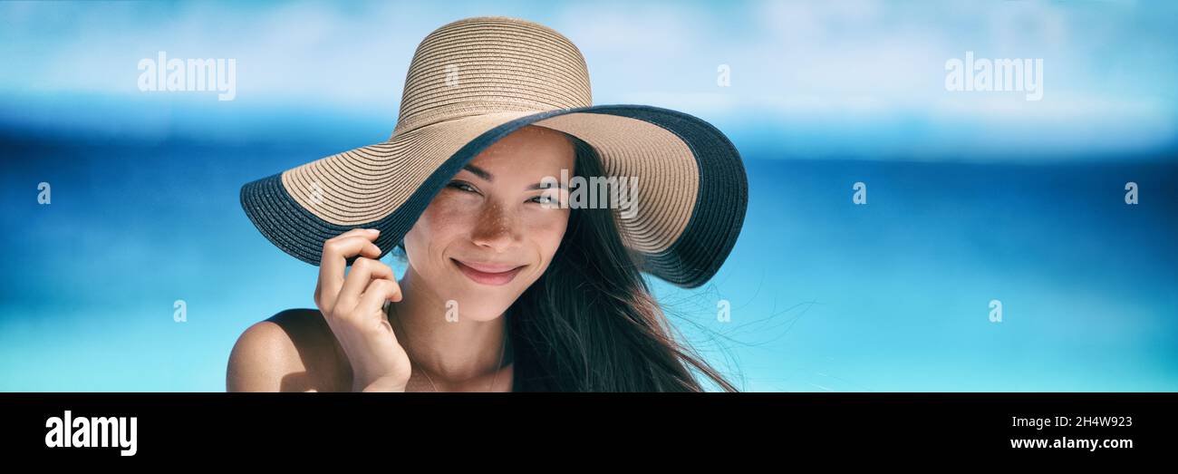 Beach asian woman skin sun protection hat on summer vacation miling ...