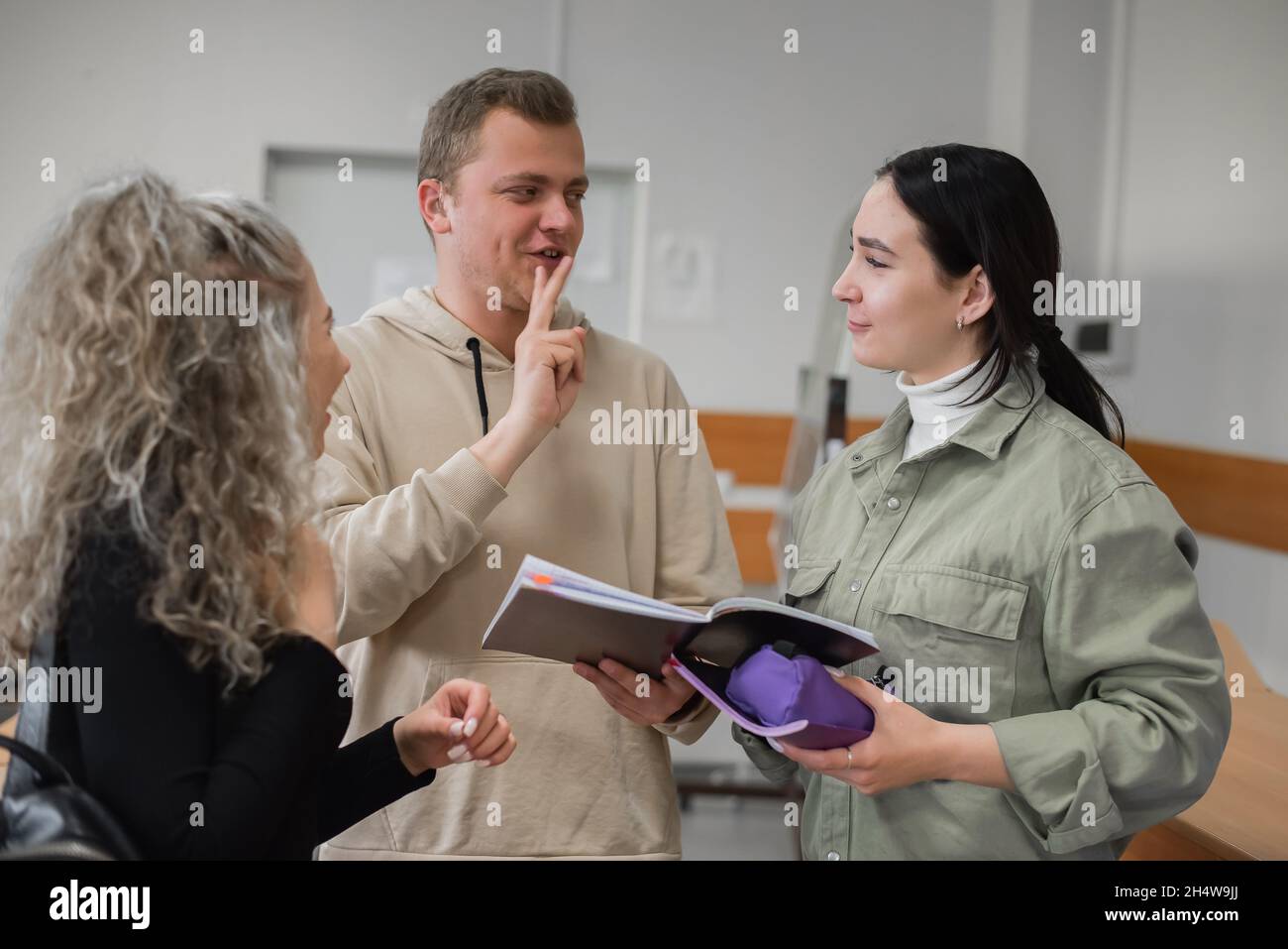 Deaf students showing sign language hi-res stock photography and images ...