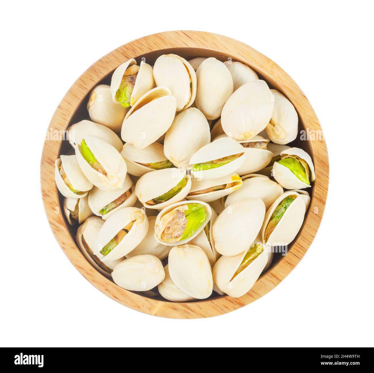 pistachio with shell nuts in wooden bowl isolated on white background ...