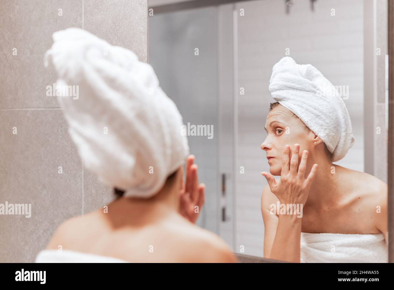 Woman applying moisturizer after beauty hi-res stock photography and ...