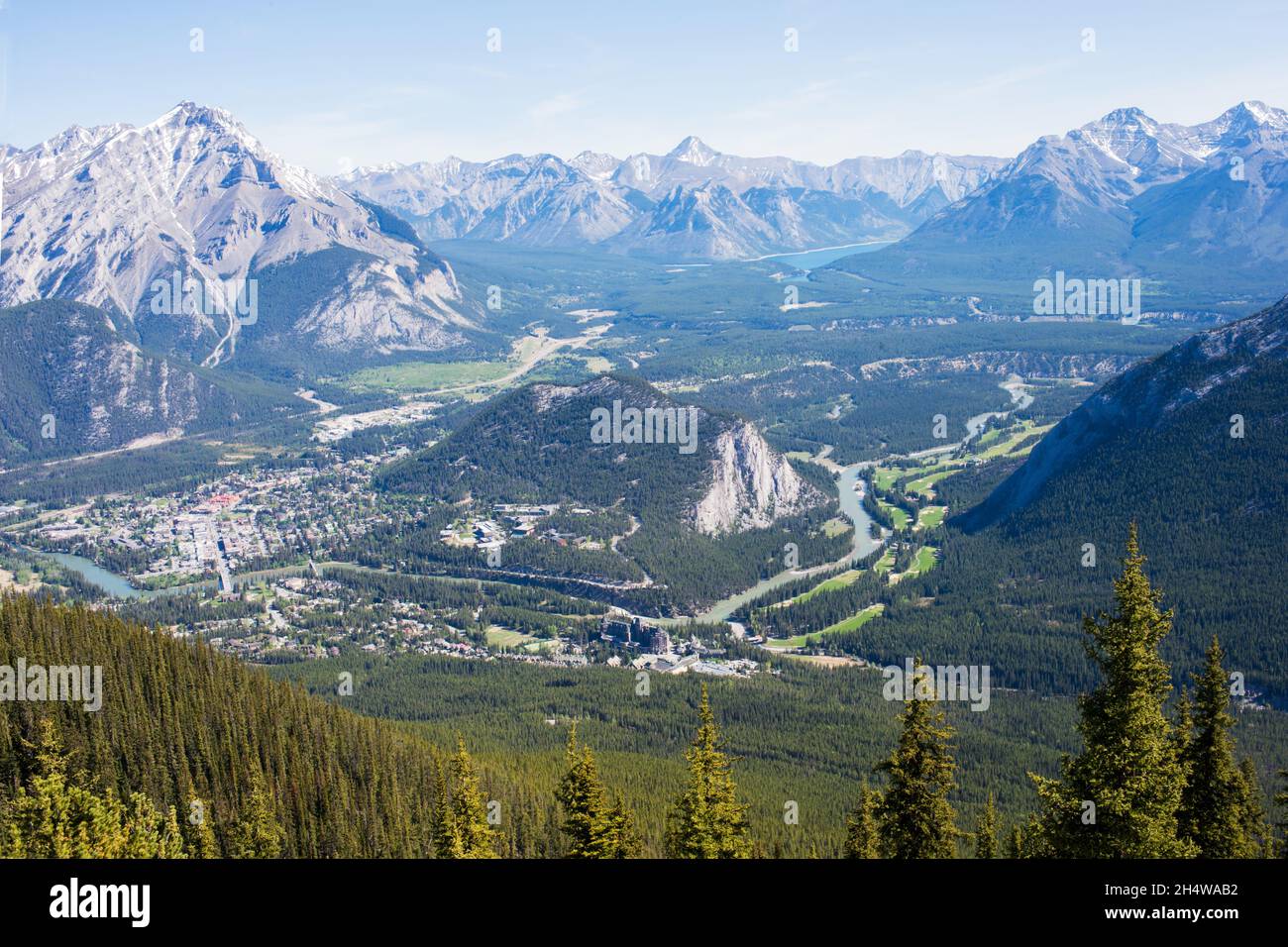 Beautiful aerial view of Rocky Mountains and river. Banff city in the ...