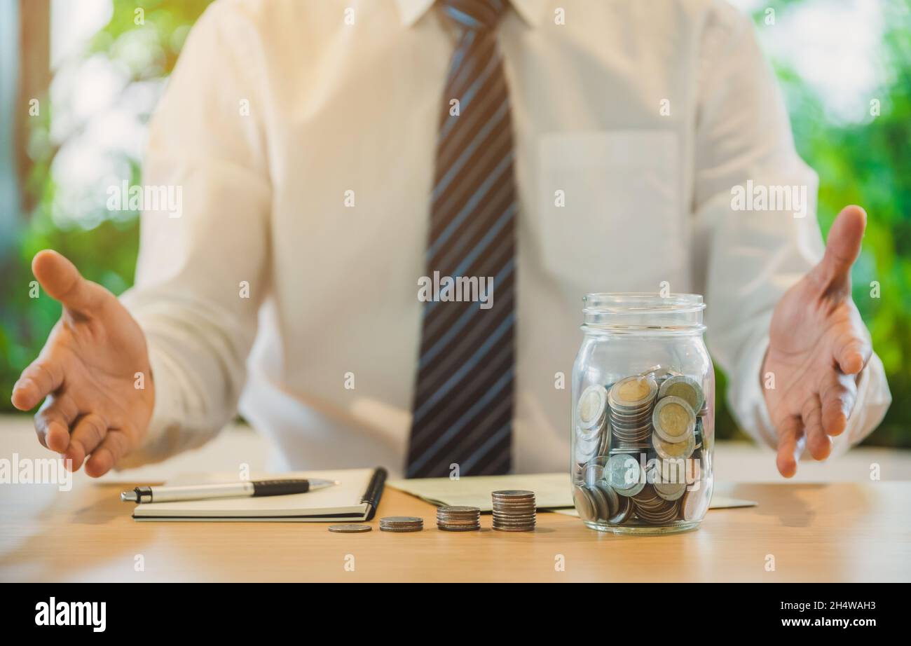 Hand holding money putting glass hi-res stock photography and images ...