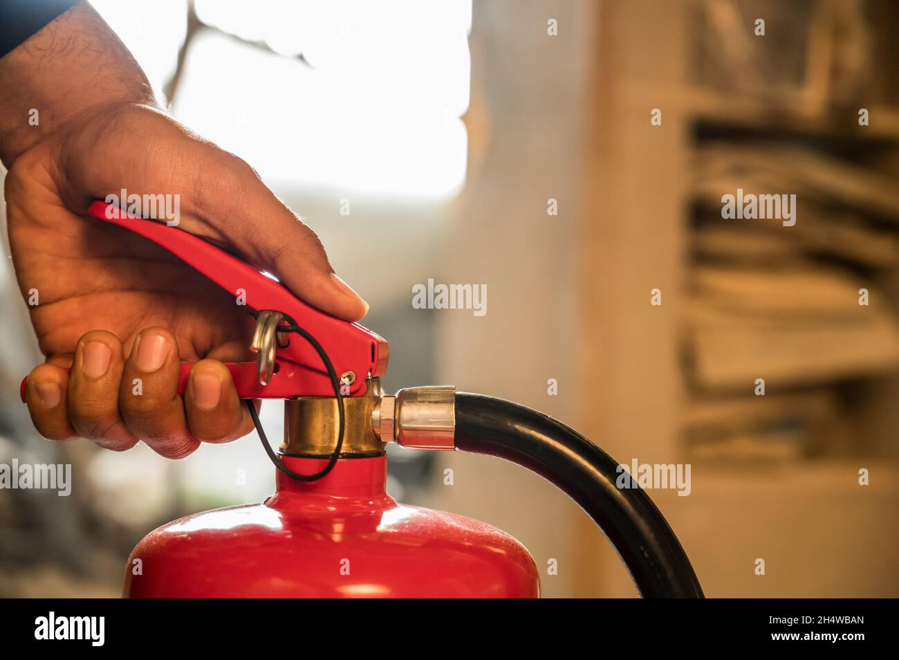 Close up hand Fireman using fire extinguisher fighting Stock Photo - Alamy