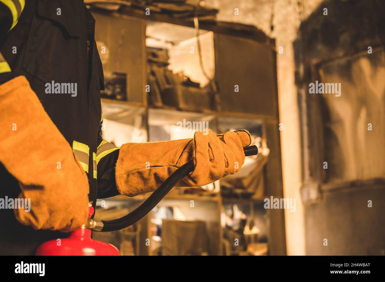Close up hand Fireman using fire extinguisher fighting Stock Photo - Alamy
