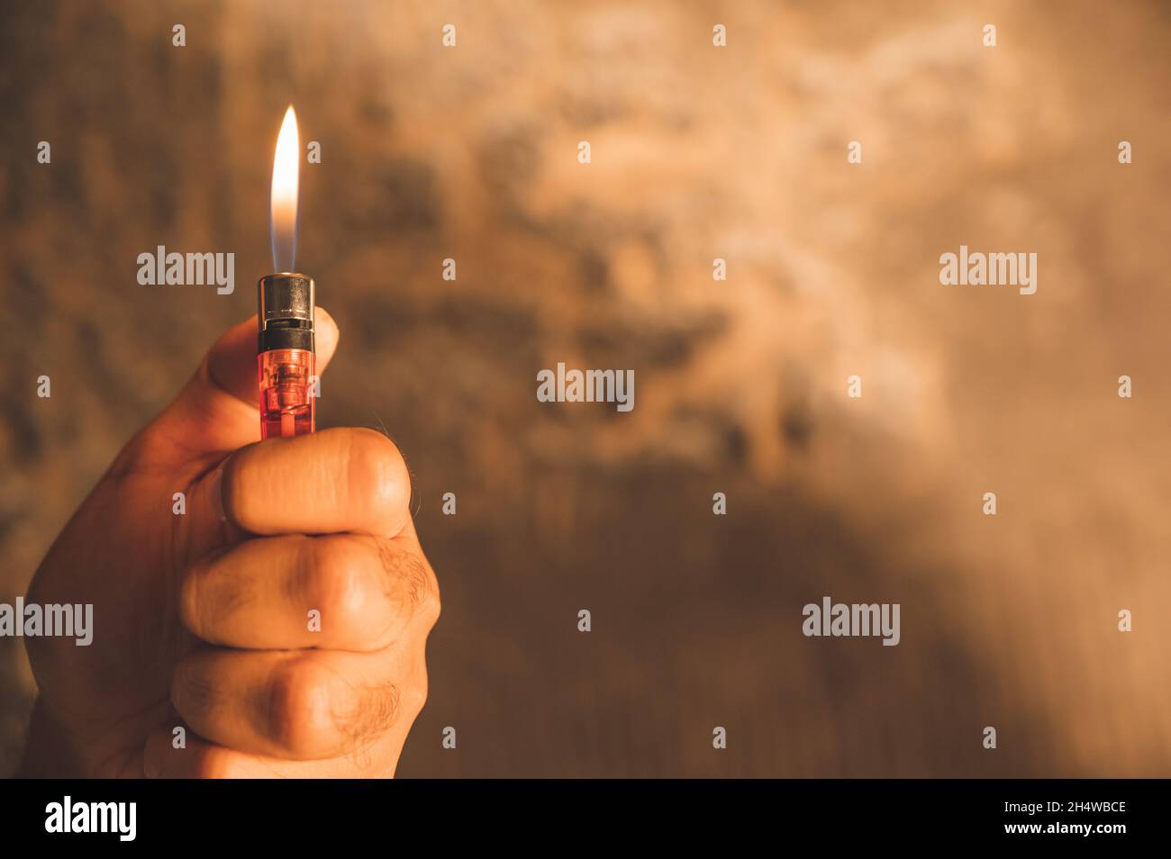 Thumb on lighter hi-res stock photography and images - Alamy