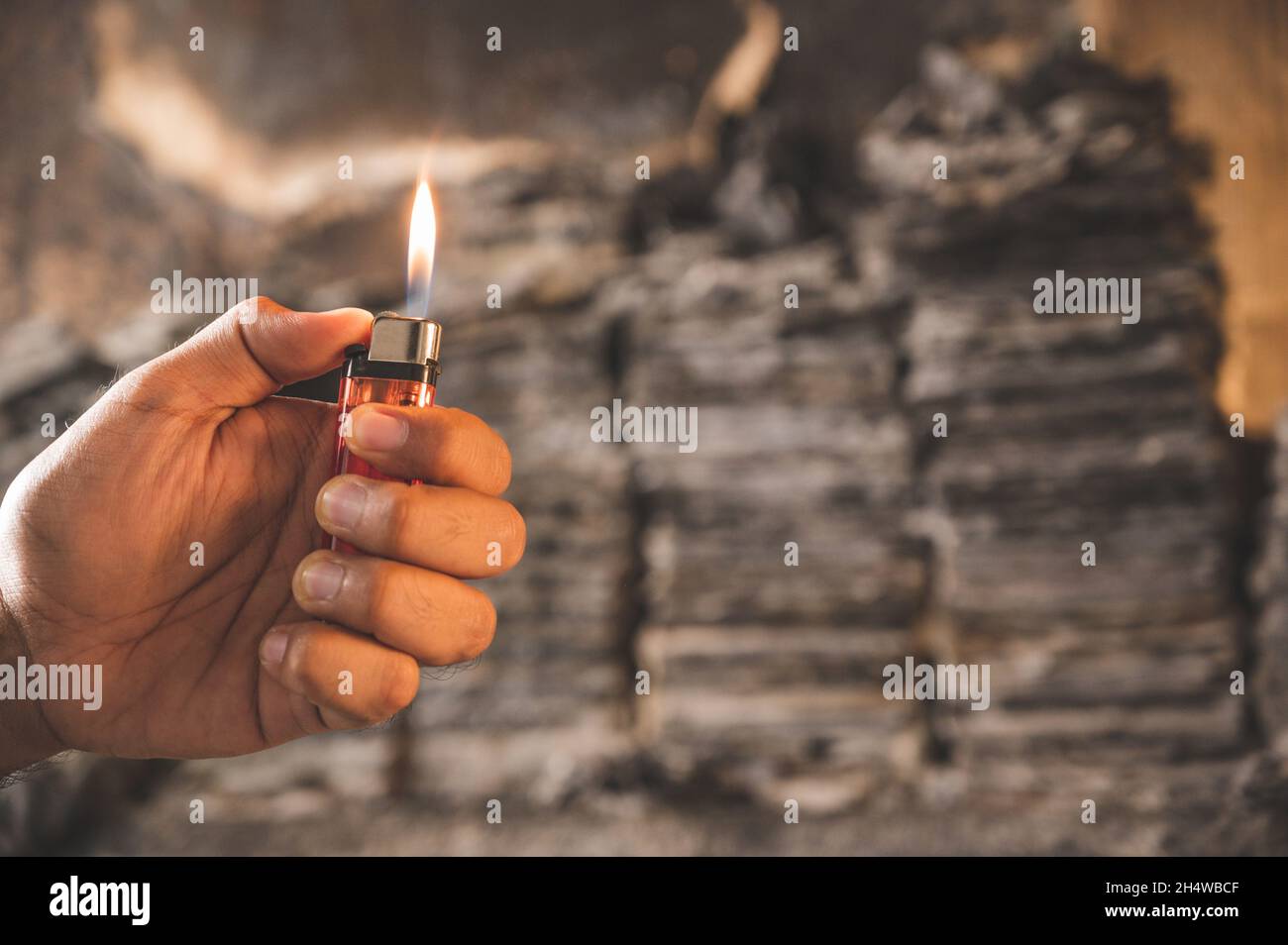 Thumb on lighter hi-res stock photography and images - Alamy