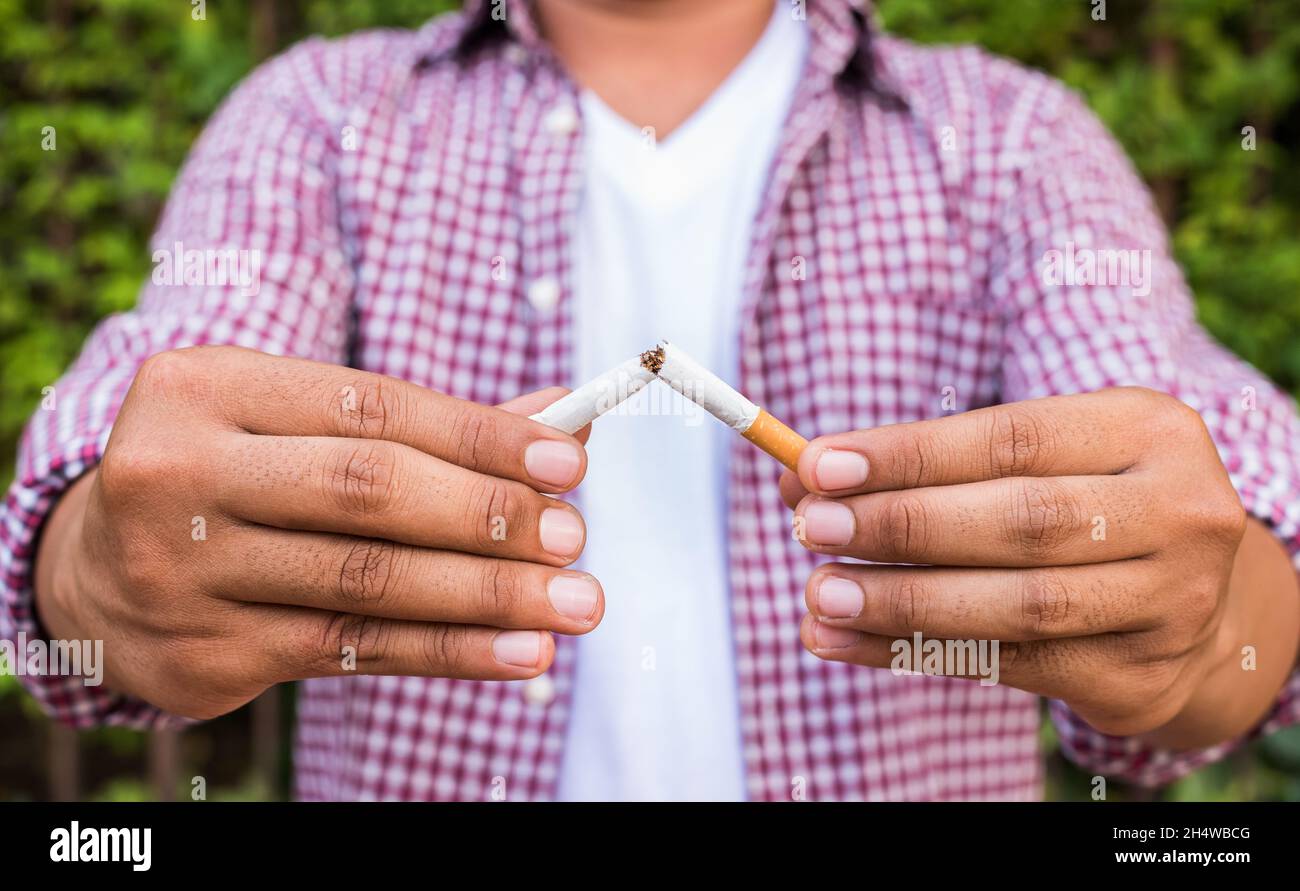 Man breaks cigarette hi-res stock photography and images - Alamy