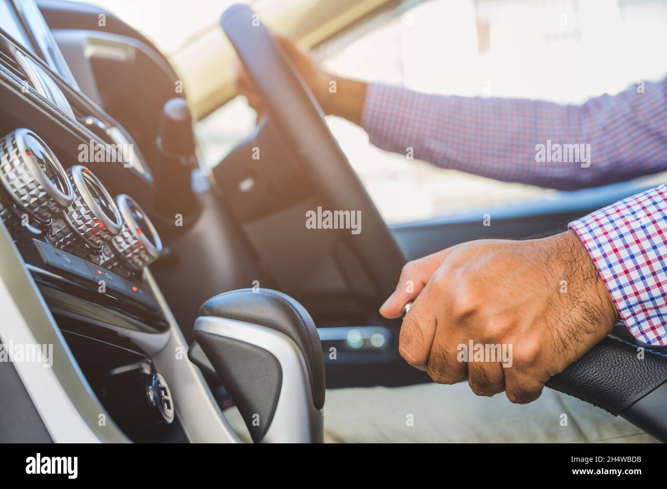 Close up hand push up car handbrake. Safety drive concept Stock Photo ...